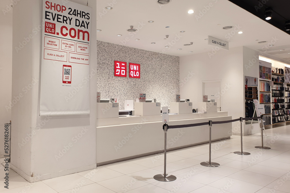 PENANG, MALAYSIA - MAR 7, 2019: Interior view of Uniqlo fashion store ...