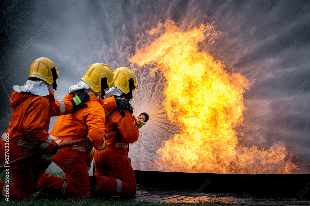 Firefighter man wearing protective fire suite and helmet with equipment ...
