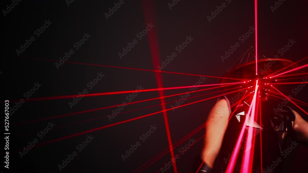 Red neon lights with man walking from black background performing ...