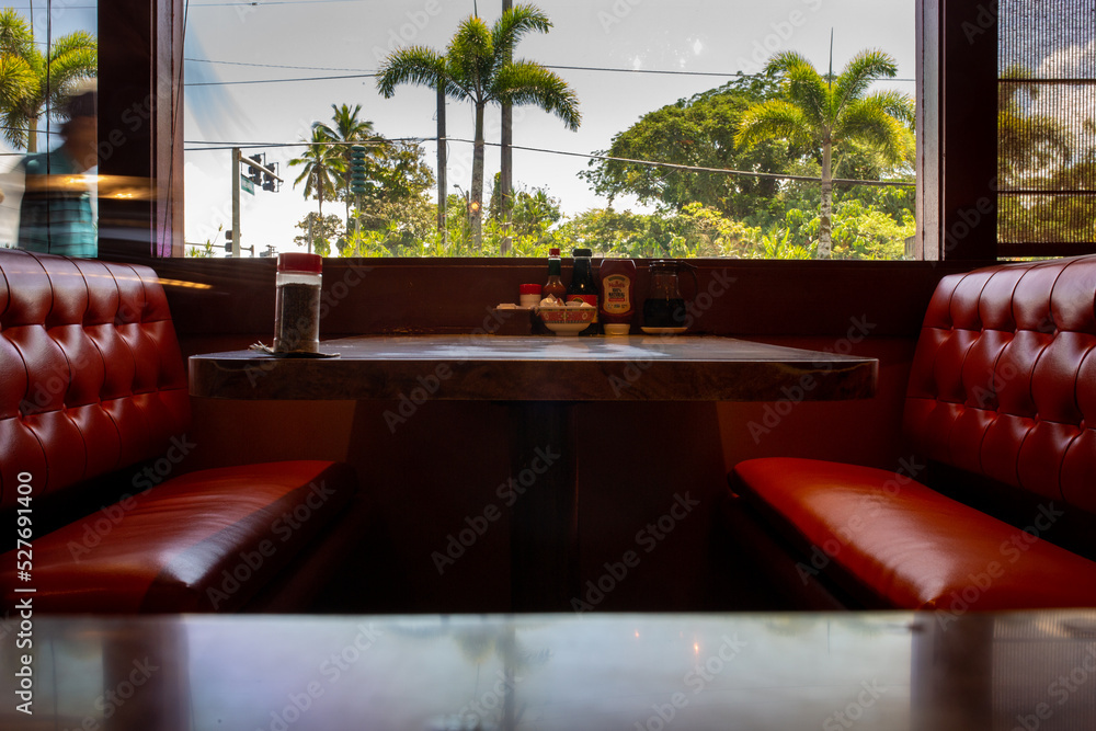 interior of a Diner, Table, seats and a view out of the window with ...
