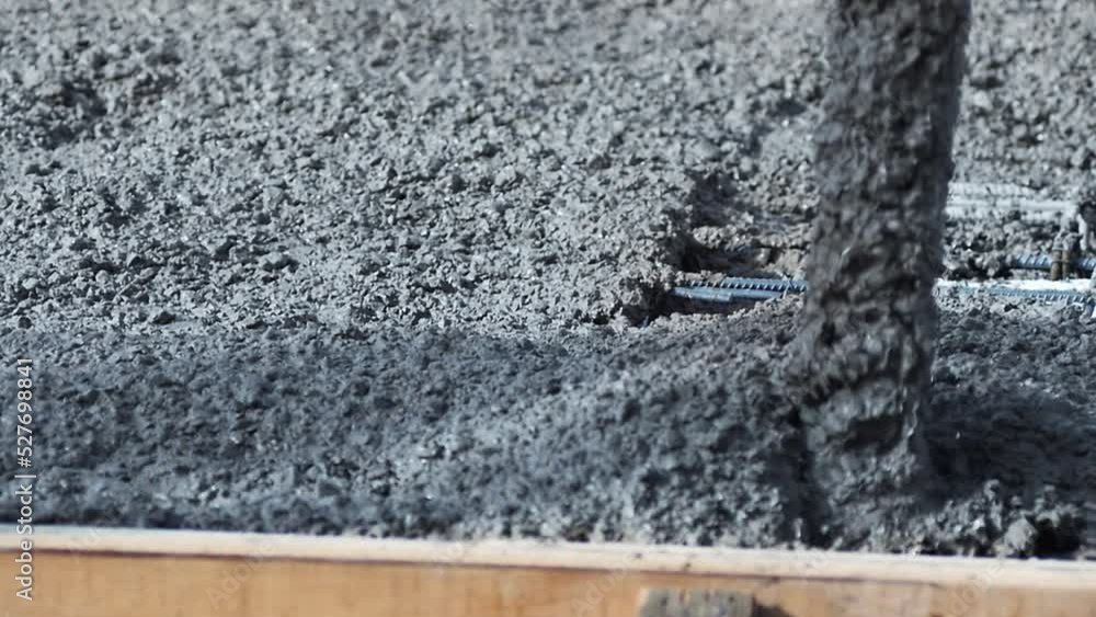 Slow Mo. Concrete mix being pouring on concreting formwork. Forming, an ...