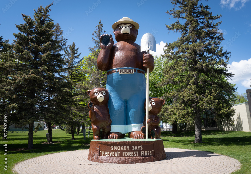 Smokey Bear statue in International Falls, Minnesota park. Traditional ...