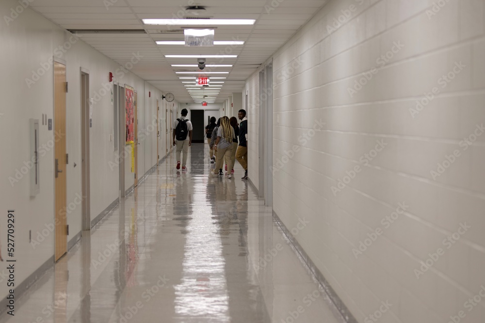 people in a school hallway Stock Photo | Adobe Stock