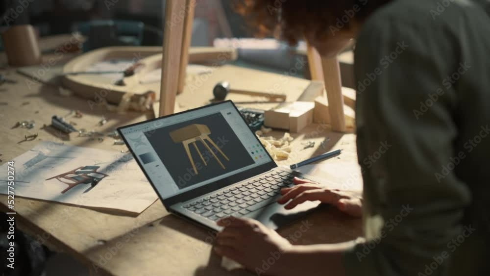 Over the Shoulder Shot of a Furniture Designer Working on Laptop ...
