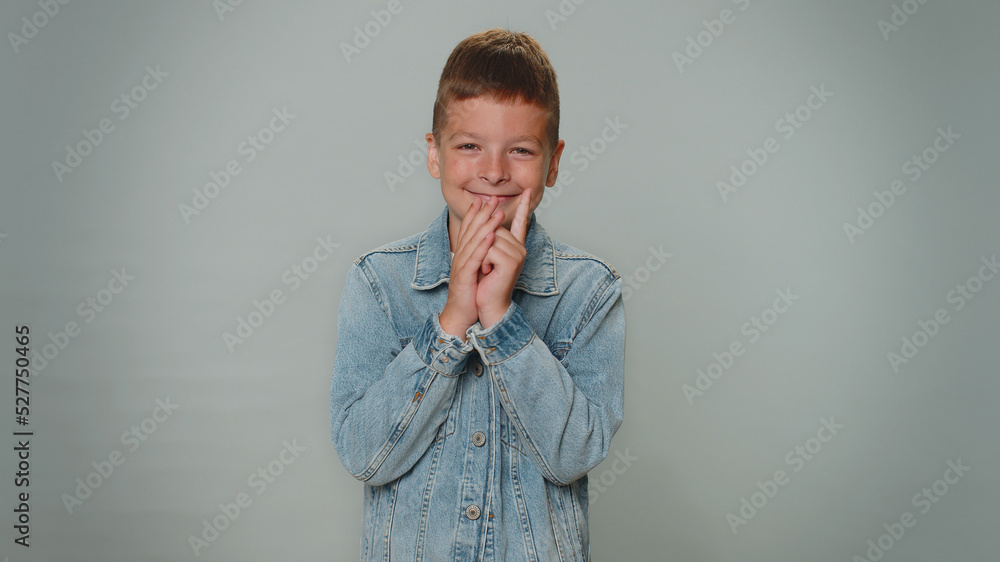 Sneaky cunning boy with tricky face gesticulating and scheming evil ...