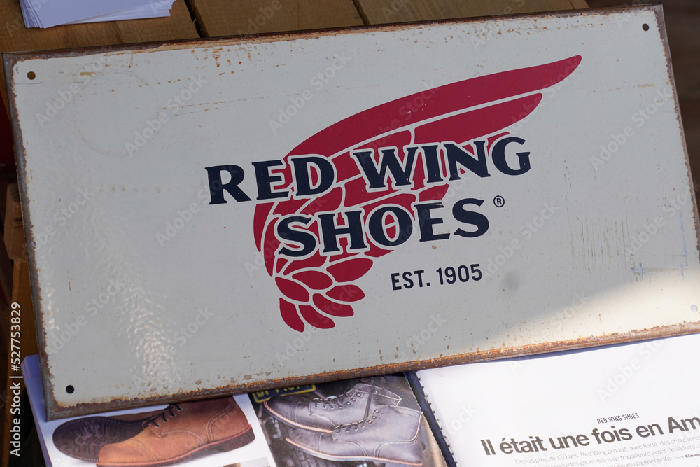 red wing shoes logo sign and brand text on store facade clothing shop ...