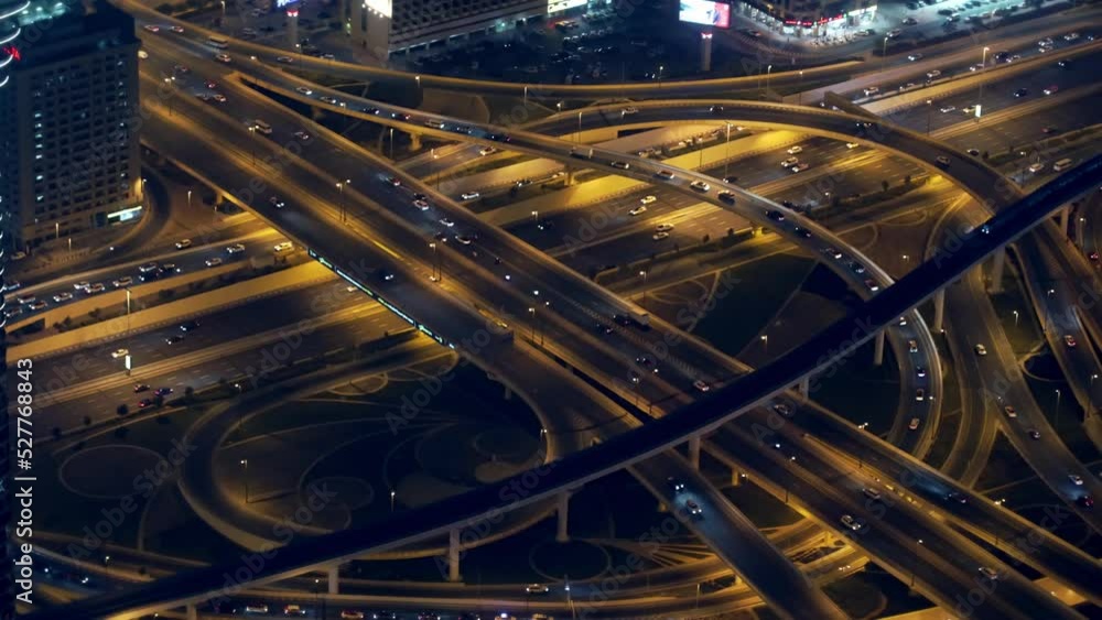 Multi-level illuminated road Burj Khalifa from bird eye view at night ...
