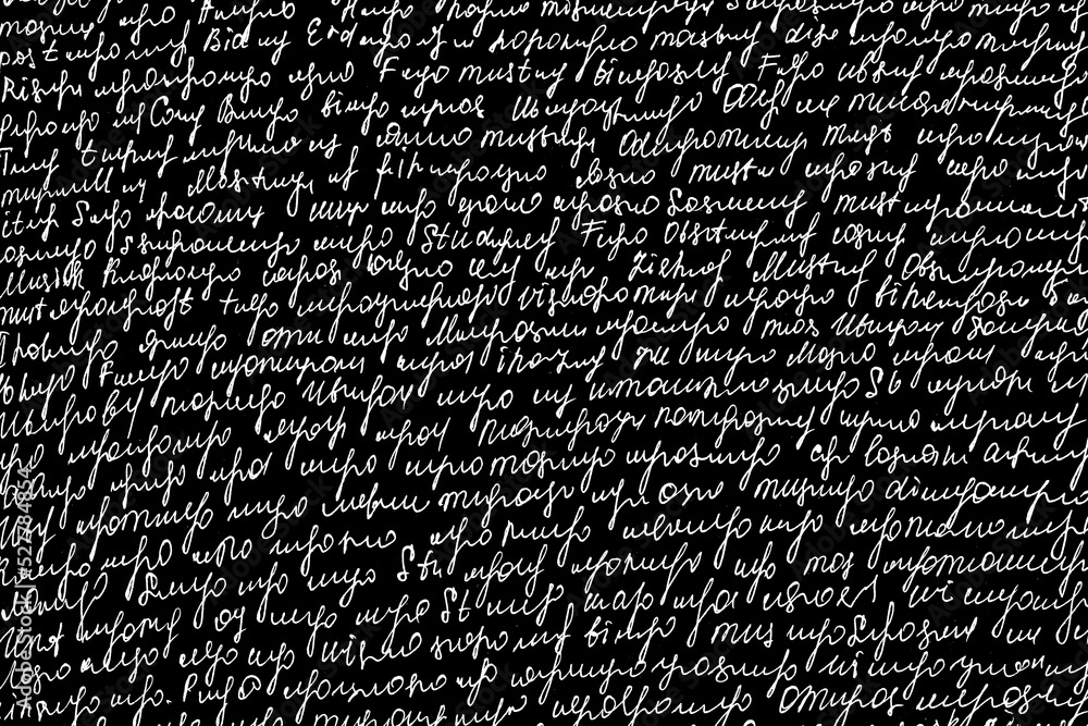 The texture of an unreadable handwritten text on a black background. An ...