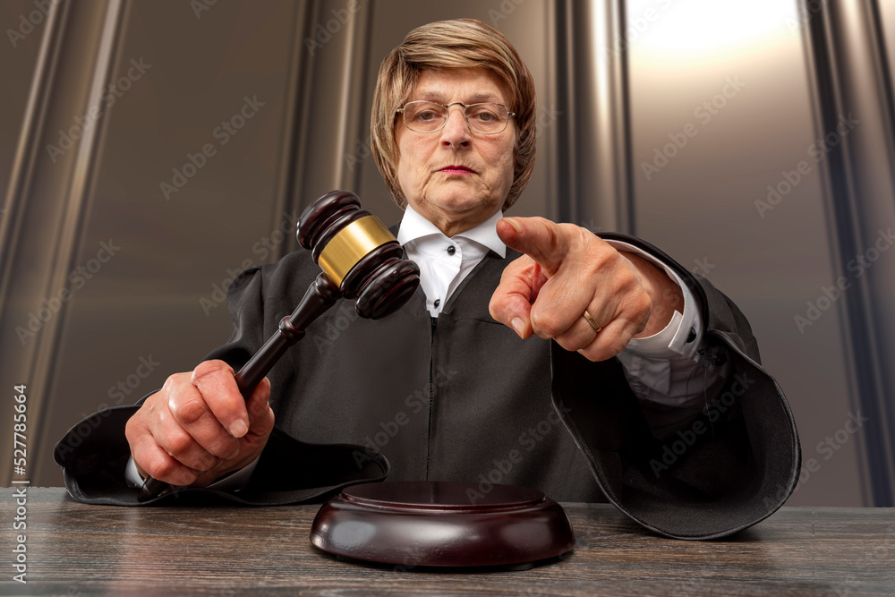 Judge banging judge's gavel, index finger pointing. Law Lord wearing ...