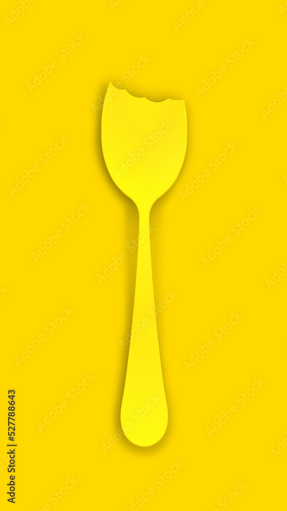 bitten spoon is yellow on yellow background. a bite mark on a spoon ...