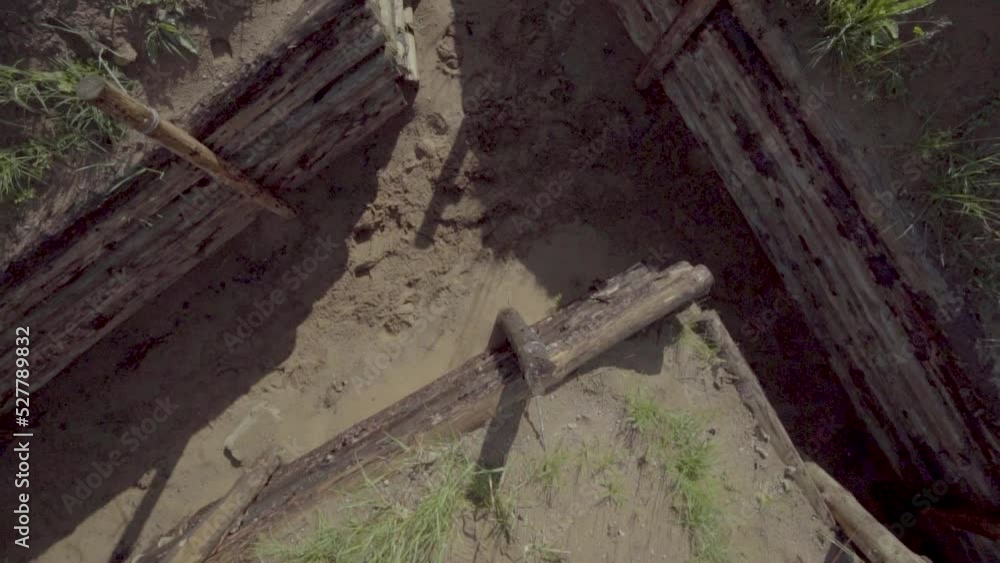 the military move with weapons and helmets in the trenches. Military ...