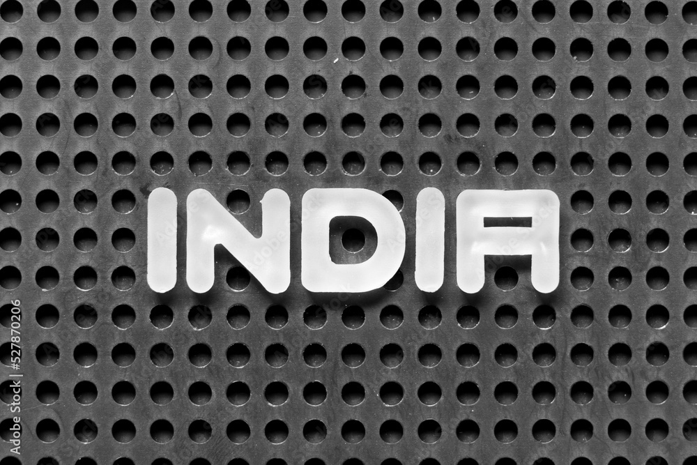 White alphabet letter in word india on black pegboard background Stock ...