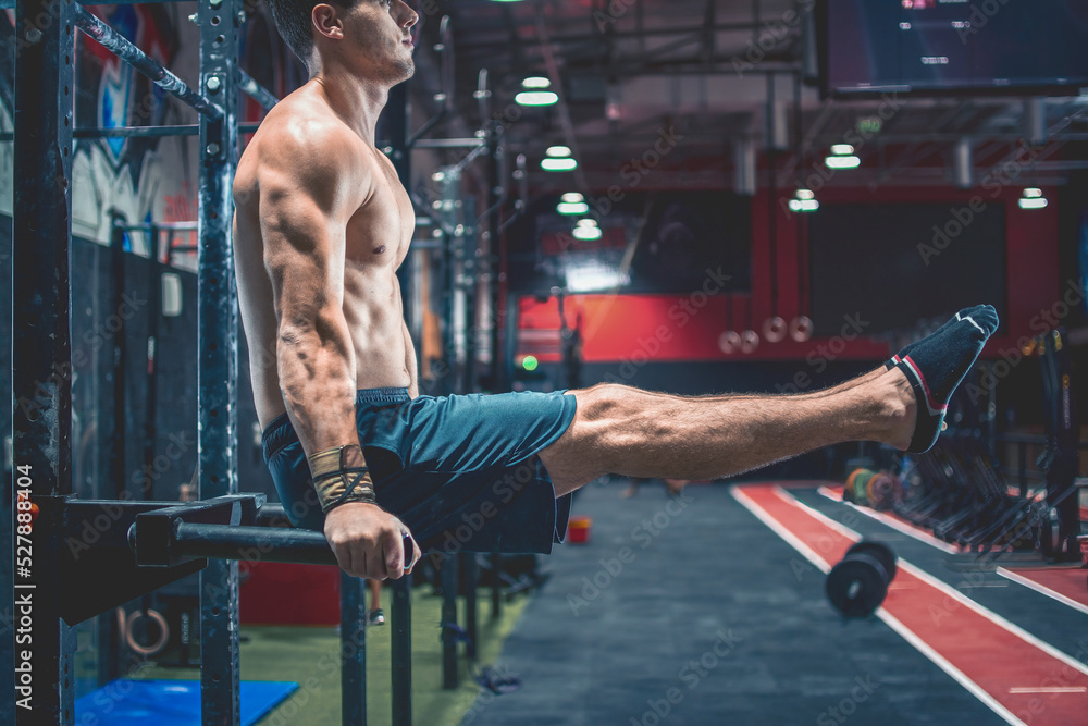 Cropped photo of young handsome shirtless man's body in L Sit position ...