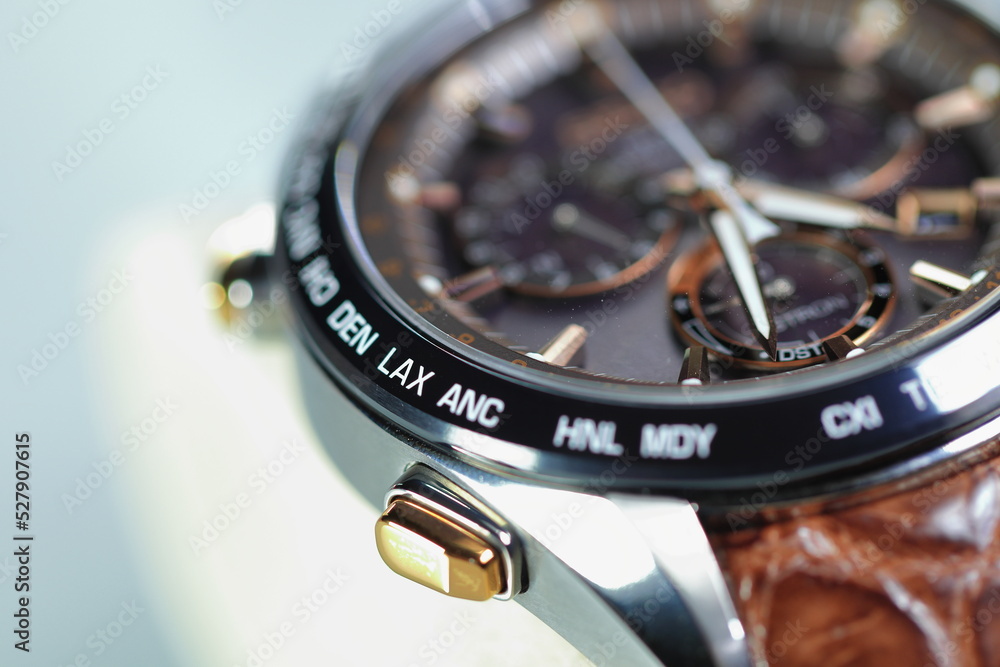 close up shallow focus Time zone cities code on luxury world time watch ...