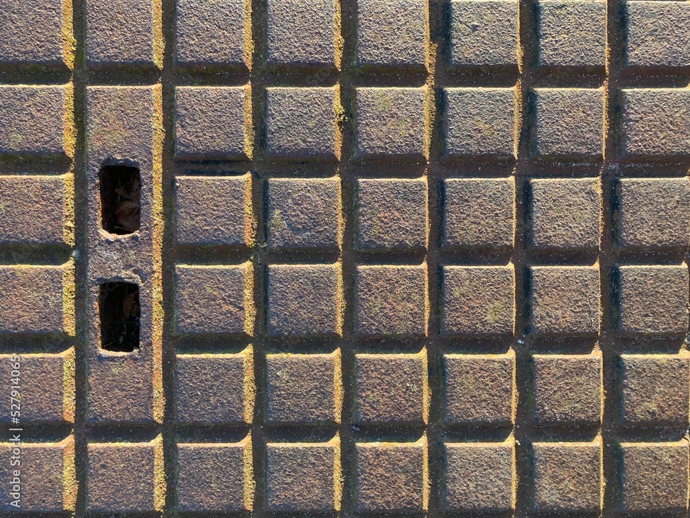 Cast iron square pattern as channel lid Stock Photo | Adobe Stock