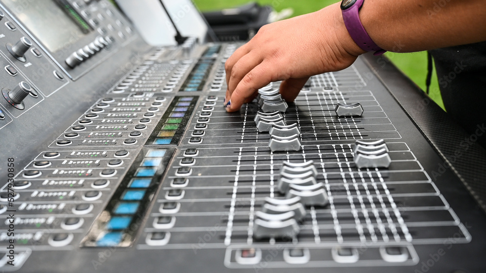 Woman works at the mixing desk. Female audio engineer. Audio mixer ...