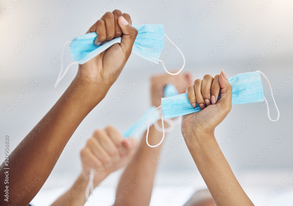 Celebration of end of covid pandemic with hands holding face mask in ...