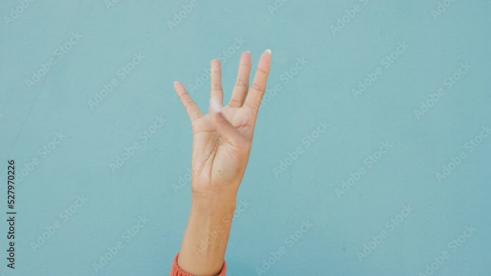 Video Stock Countdown fingers or hand gesture on a mockup blue wall ...