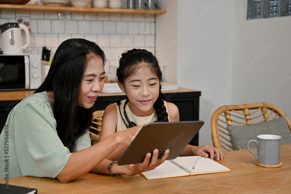 Asian Mom helping her daughter learning online class with tablet, Online learning, E-learning ...