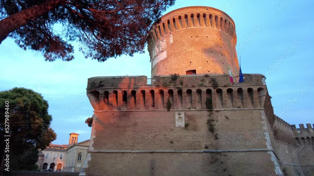 Pan right at beautiful facade of ancient medieval castle of Julio II ...