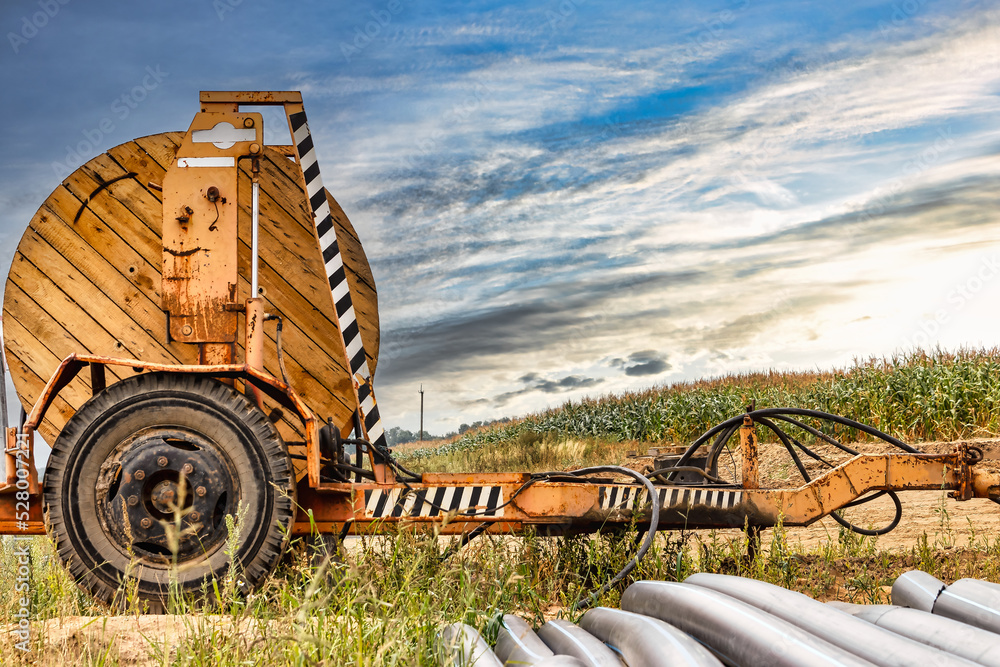 Wooden reel with high voltage cable mounted on a trailer for easy ...