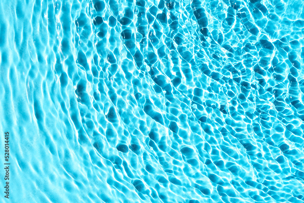 Beautiful blue water texture background, water surface with sun rays ...