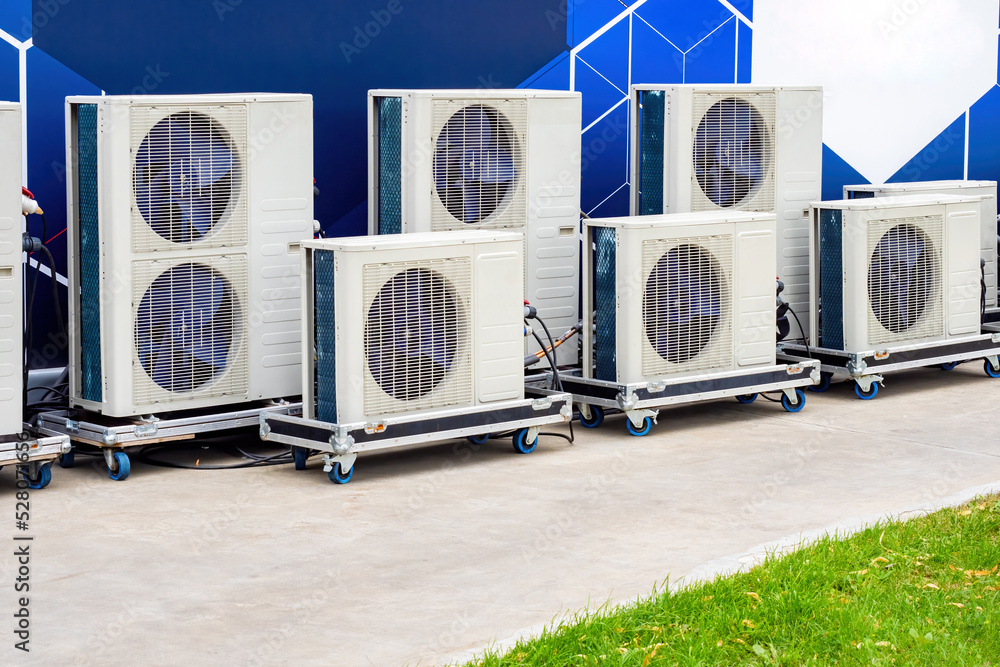 Air conditioners. Outdoor units of air conditioners on wheels. Split ...