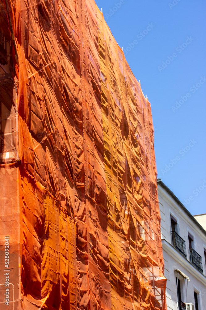 Protective net. Reconstruction of facade of historic classical ...