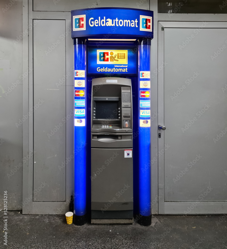 Kiel, Germany - 03 September 2022: A blue ATM with numerous logos and ...