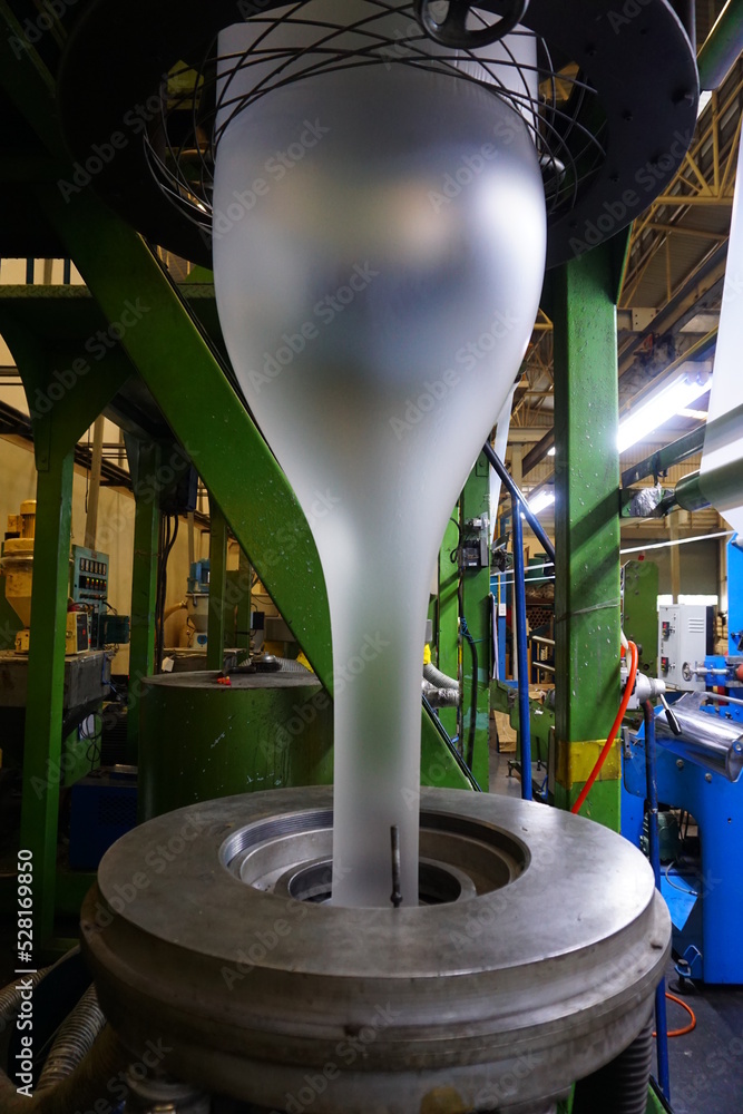 LDPE. extrusion blown film machine showing bubble extruded from die ...