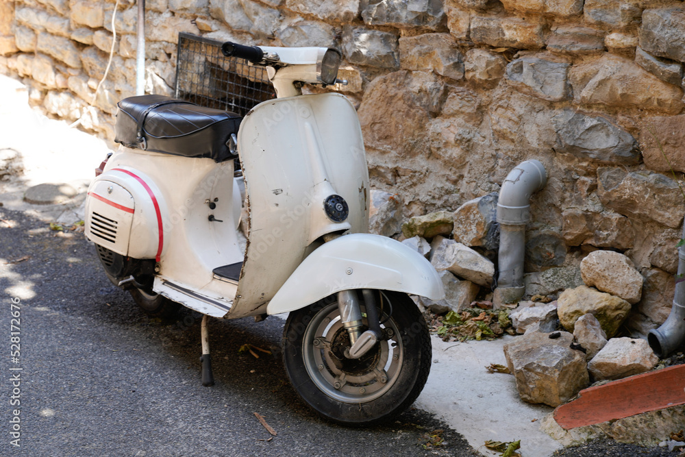 Vespa Vintage scooter moped in sixties concept parked in street with ...