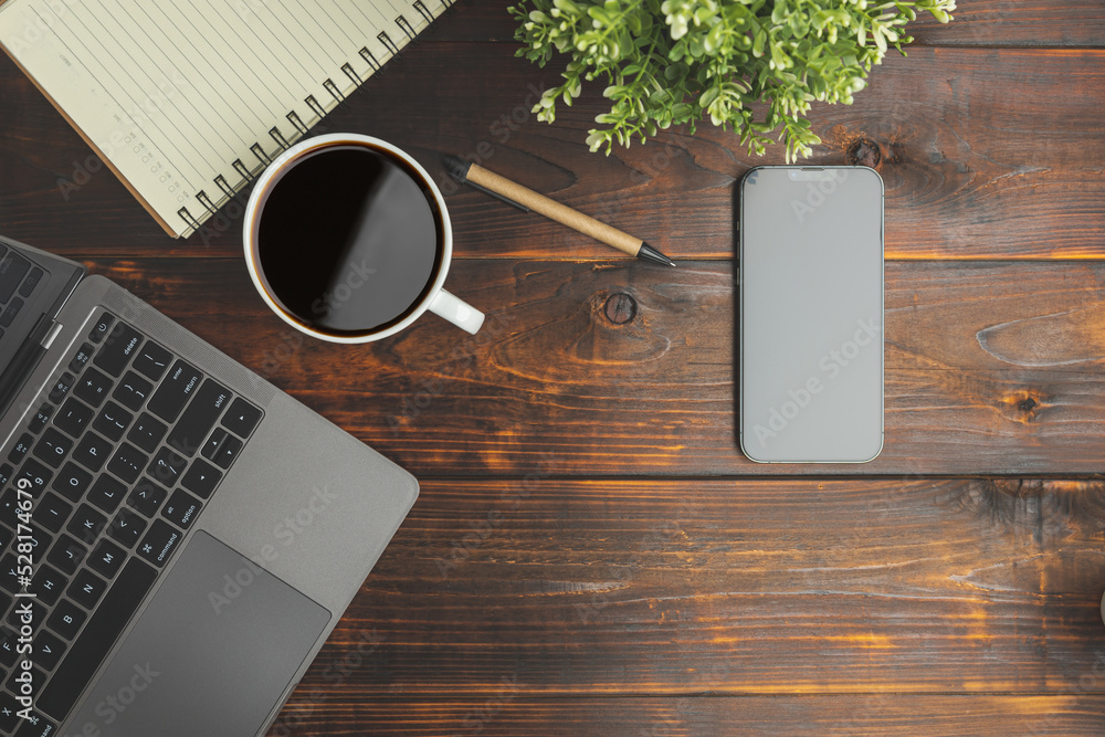 Workspace top view desk of work office with laptop, smartphones, a pen ...