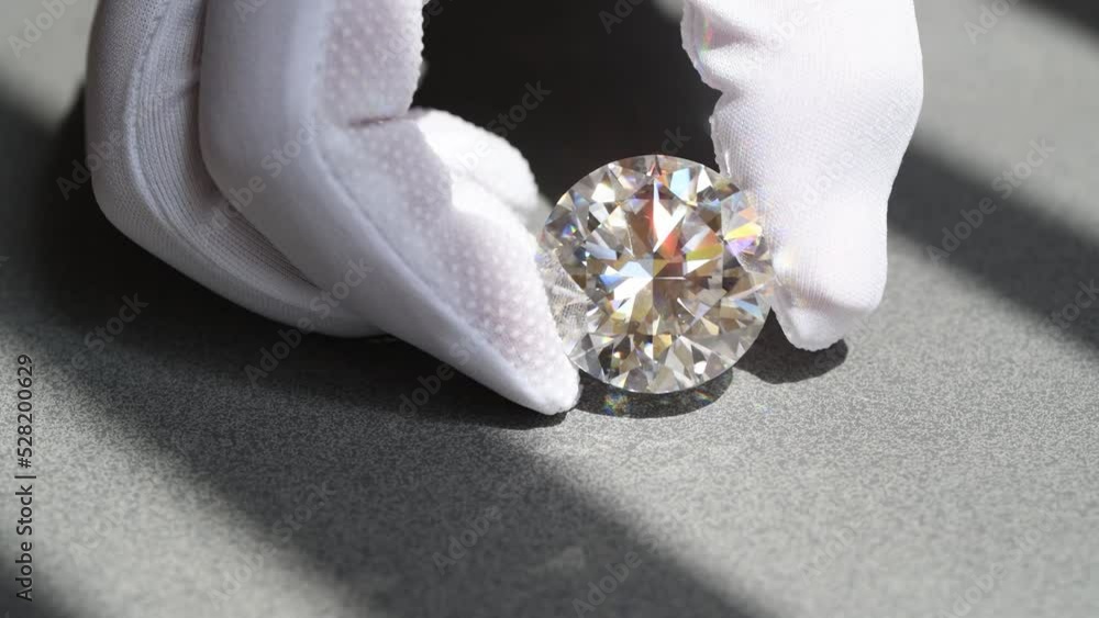 Big Diamond Sparkling in Hands Jewelry Inspection Stock Video | Adobe Stock
