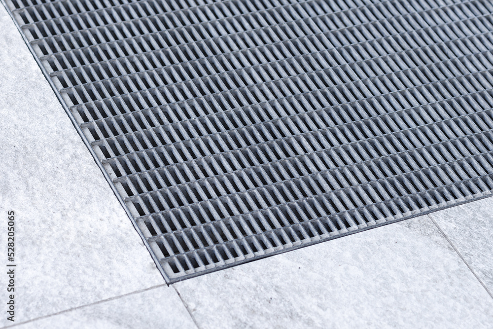 Floor drainage and anti-slip metal grate at the entrance to the ...