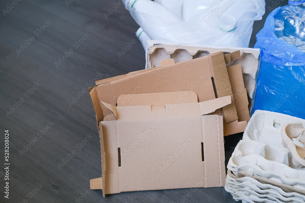 Cardboard boxes, carton and egg package, plastic bottles are separated ...