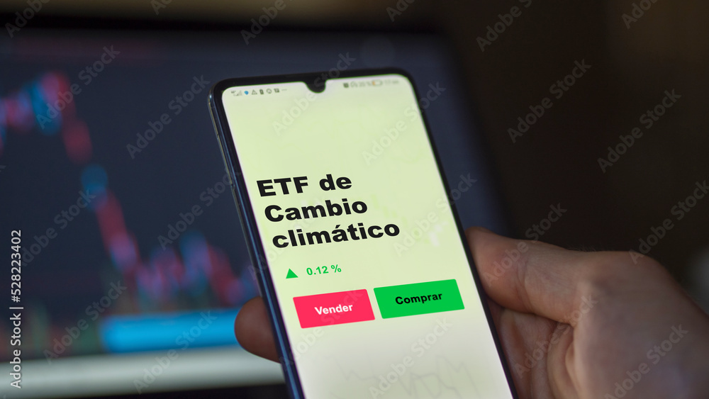 Un investisseur analyse l'etf sur le changement climatique sur fond d'écran. Un téléphone ...
