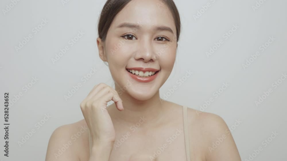 Close-up beauty portrait of beautiful Asian woman look at camera ...
