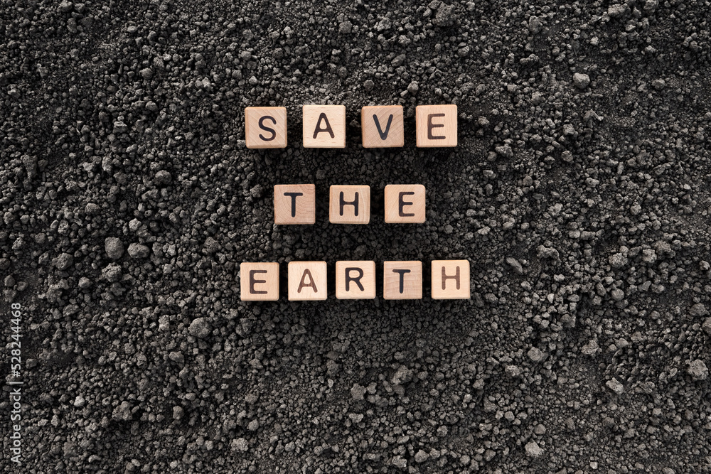 Black soil background earth day. Letter block toy cube wood text Save ...