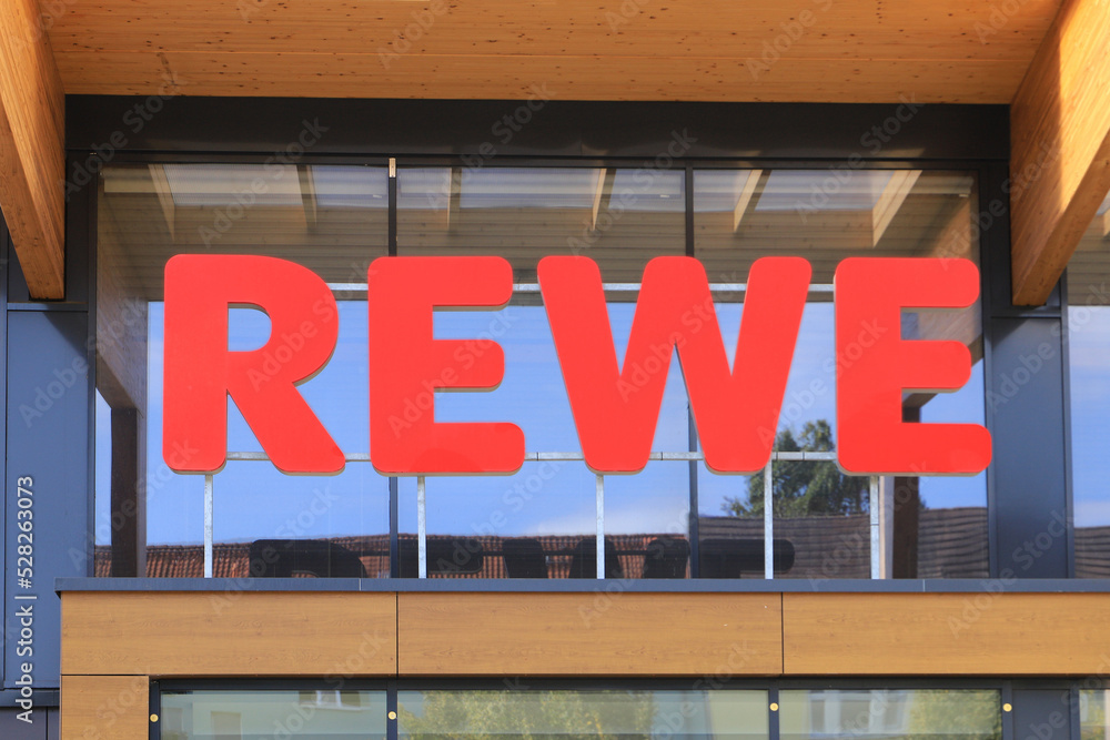 Rewe supermarket logo - a German supermarket chain with stores across ...
