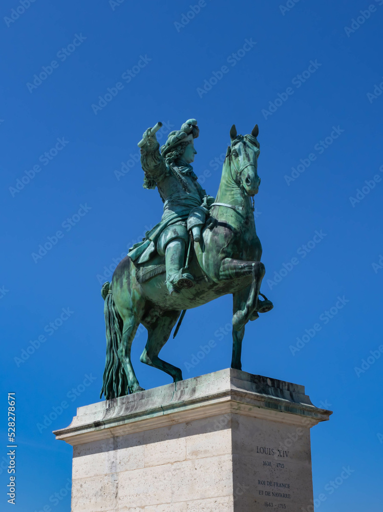 Versailles, France - July 16th 2022: Statue of Louis XIV in front of ...