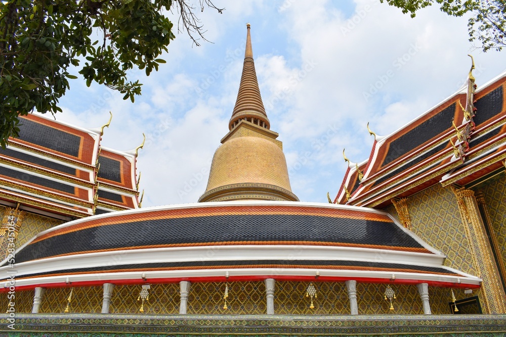 Golden pagoda and the curved walkway around the circular cloister of ...