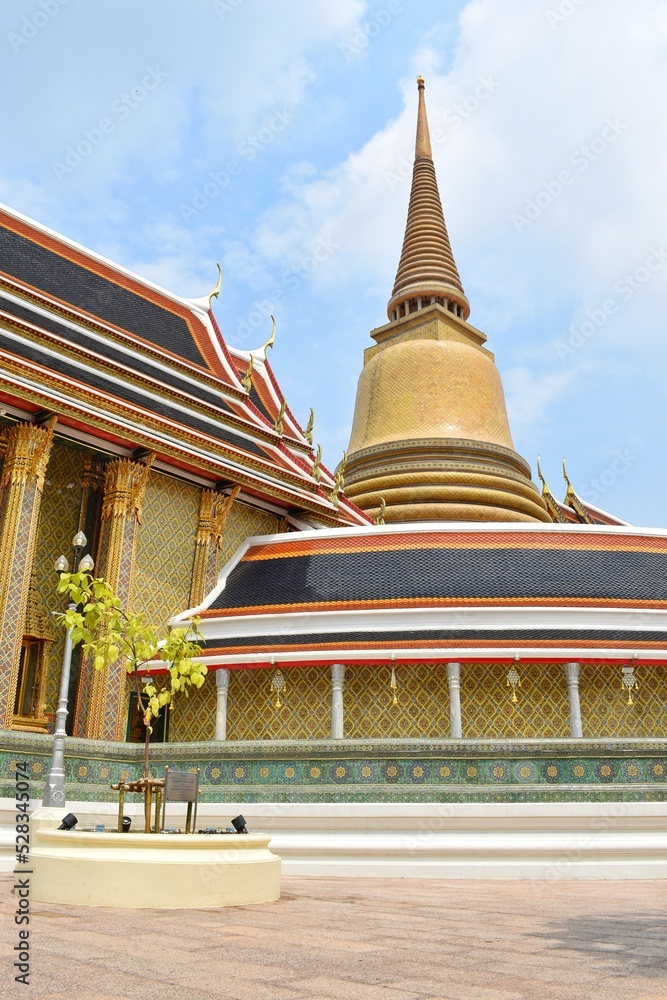 Golden pagoda and the curved walkway around the circular cloister of ...