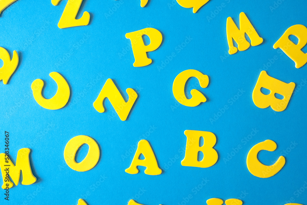 Colorful letters of the alphabet on a blue background. Elementary ...