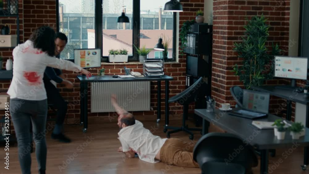 Scared african american man hiding under table from crawling spooky ...