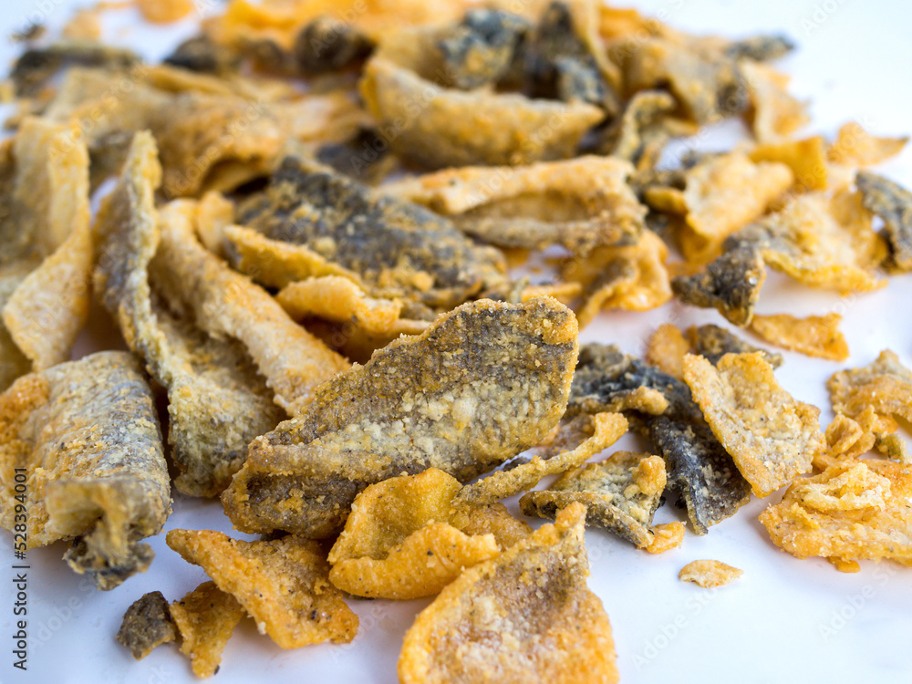 Crispy fish skin on white background.Crispy fish skin snack and used as ...