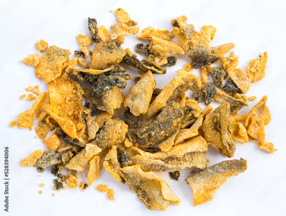 Crispy fish skin on white background.Crispy fish skin snack and used as ...