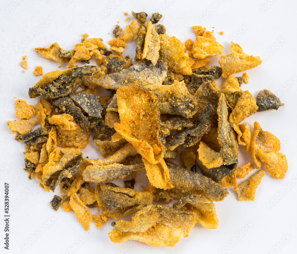 Crispy fish skin on white background.Crispy fish skin snack and used as ...