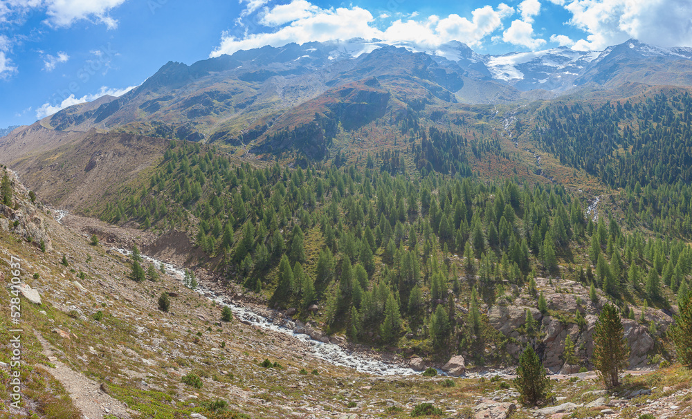 Spectacular alpine panorama with ancient left glacial moraine cross by ...