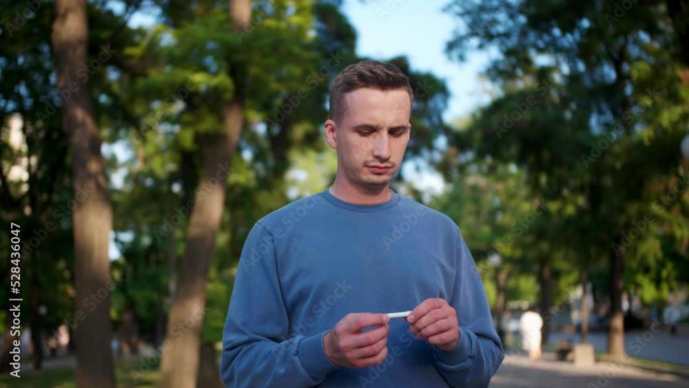 Man breaks cigarette and quits smoking on street, slow motion Stock ...