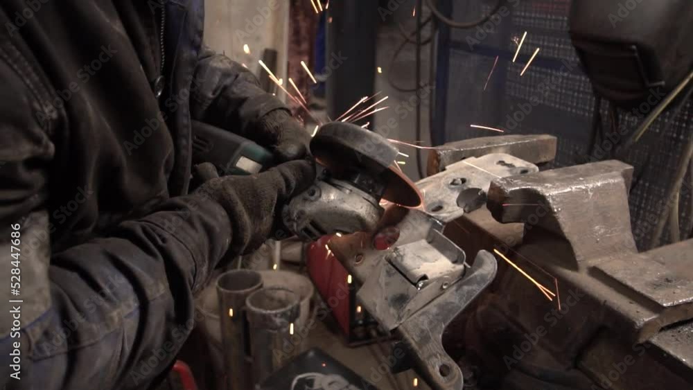 Metal cutting process wirh lots of grinding sparks. Round saw cuts ...